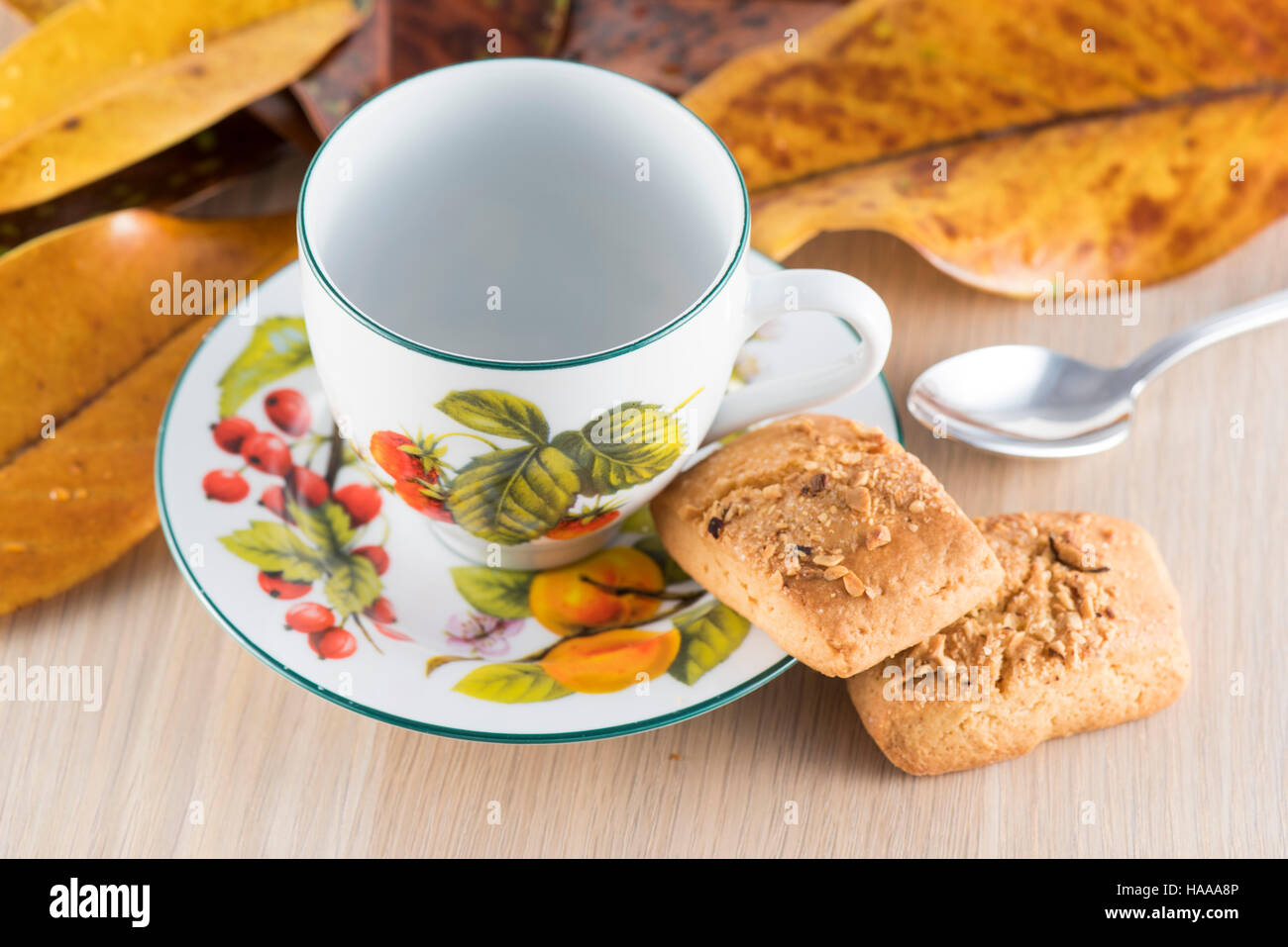 Tea cup and Magnolia Grandiflora leaf Stock Photo - Alamy