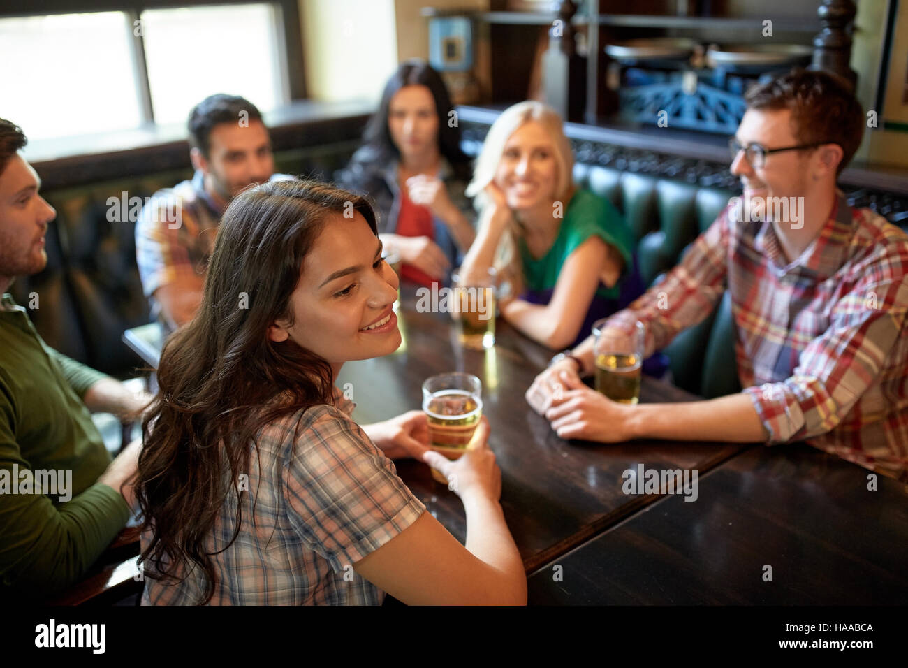 happy friends drinking beer at bar or pub Stock Photo - Alamy