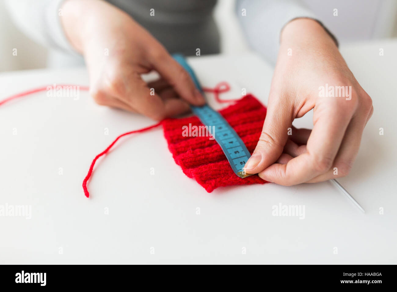 woman with knitting on needle and measuring tape Stock Photo - Alamy