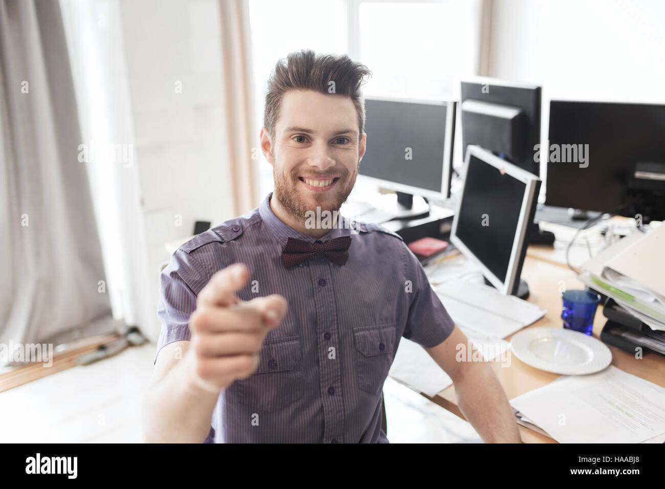 happy male office worker pointing finger at you Stock Photo - Alamy