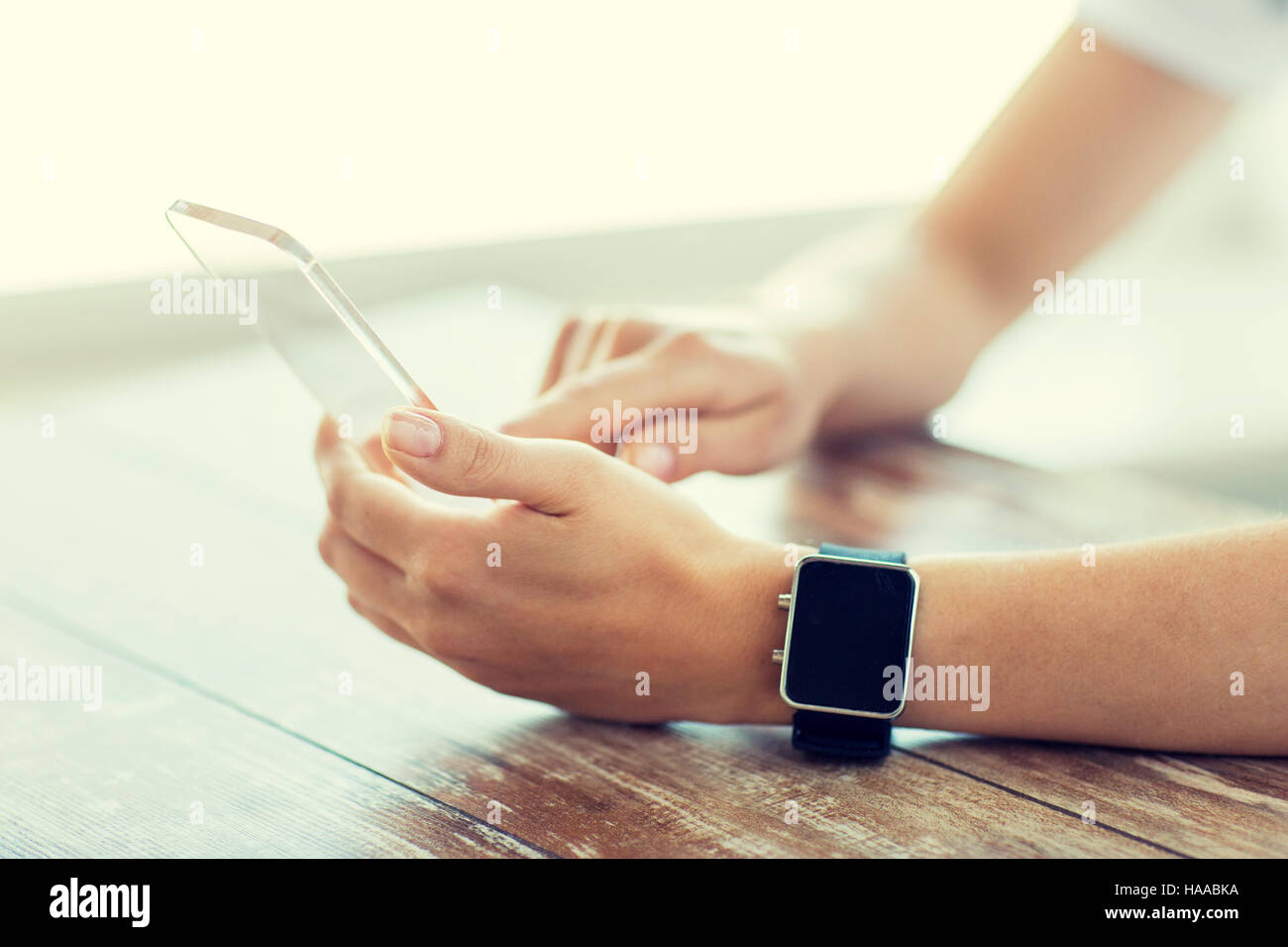 close up of hands with smart phone and watch Stock Photo - Alamy