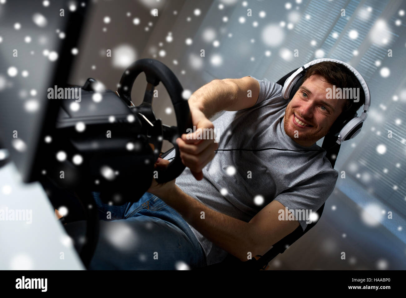 man playing car racing video game at home Stock Photo - Alamy