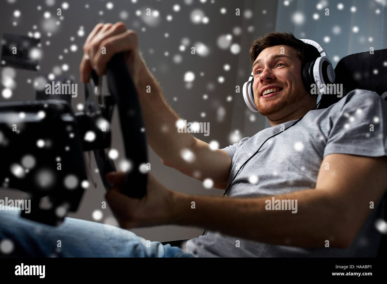 man playing car racing video game at home Stock Photo - Alamy