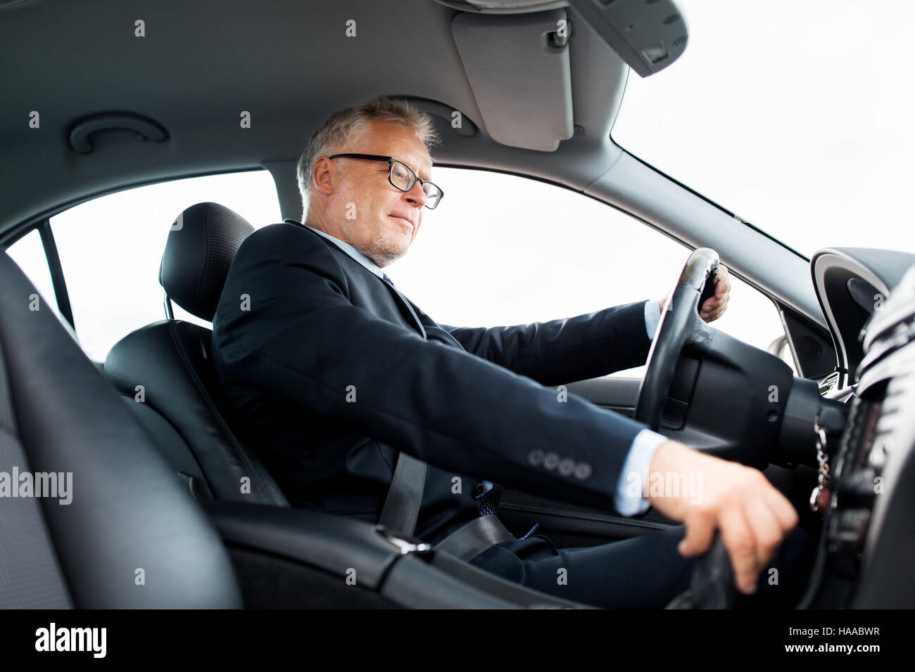 happy senior businessman driving car Stock Photo - Alamy