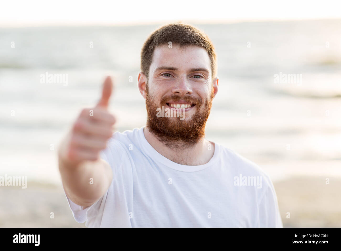happy smiling young man on beach Stock Photo - Alamy happy smiling young man on beach Stock Photo - Alamy