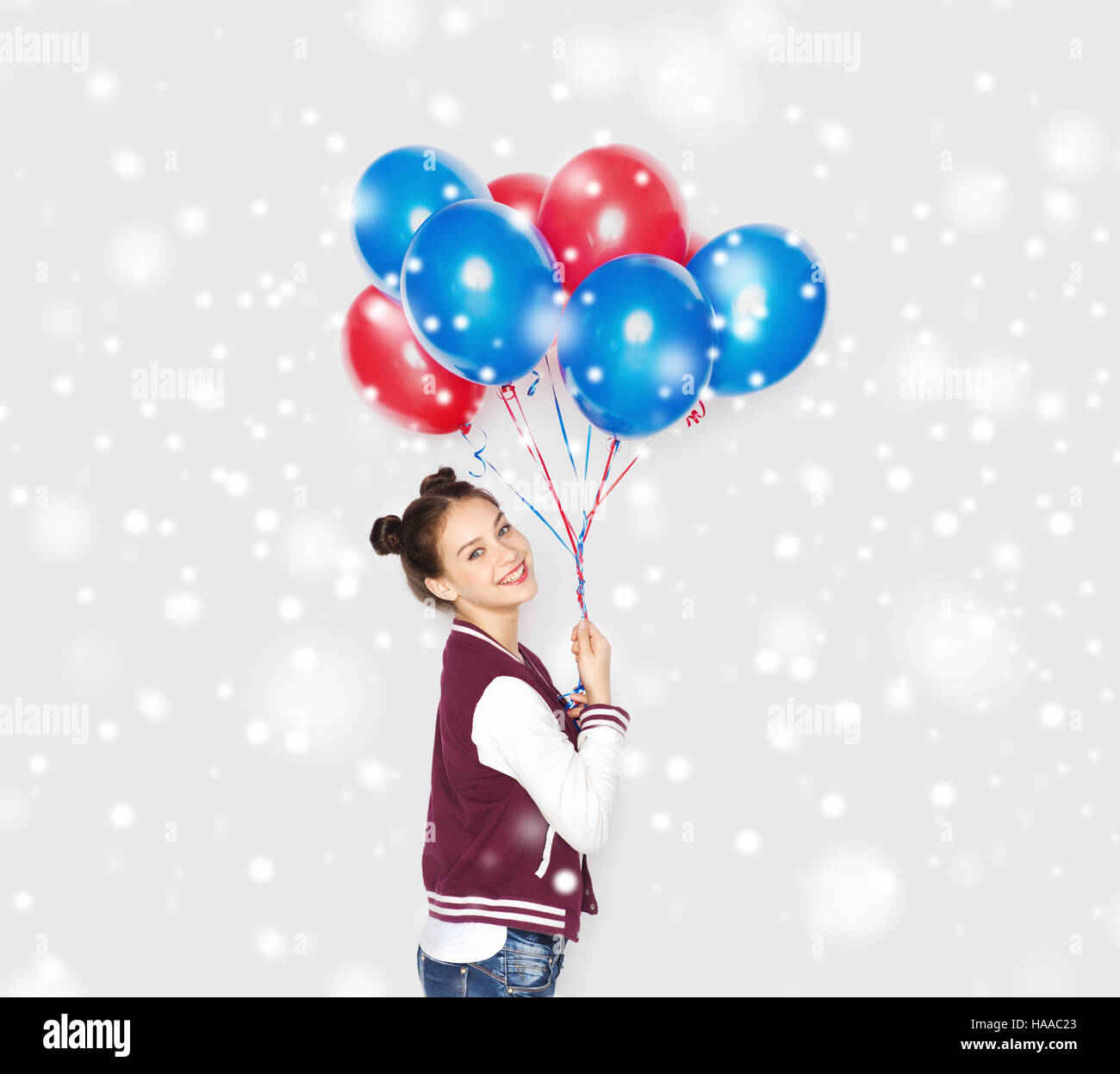 happy teenage girl with helium balloons over snow Stock Photo - Alamy