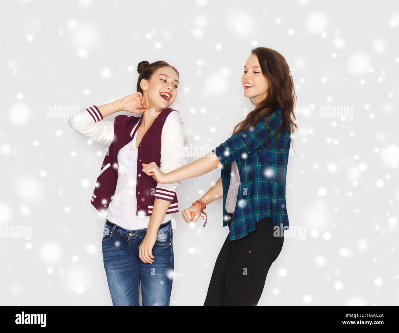 happy smiling pretty teenage girls dancing Stock Photo - Alamy