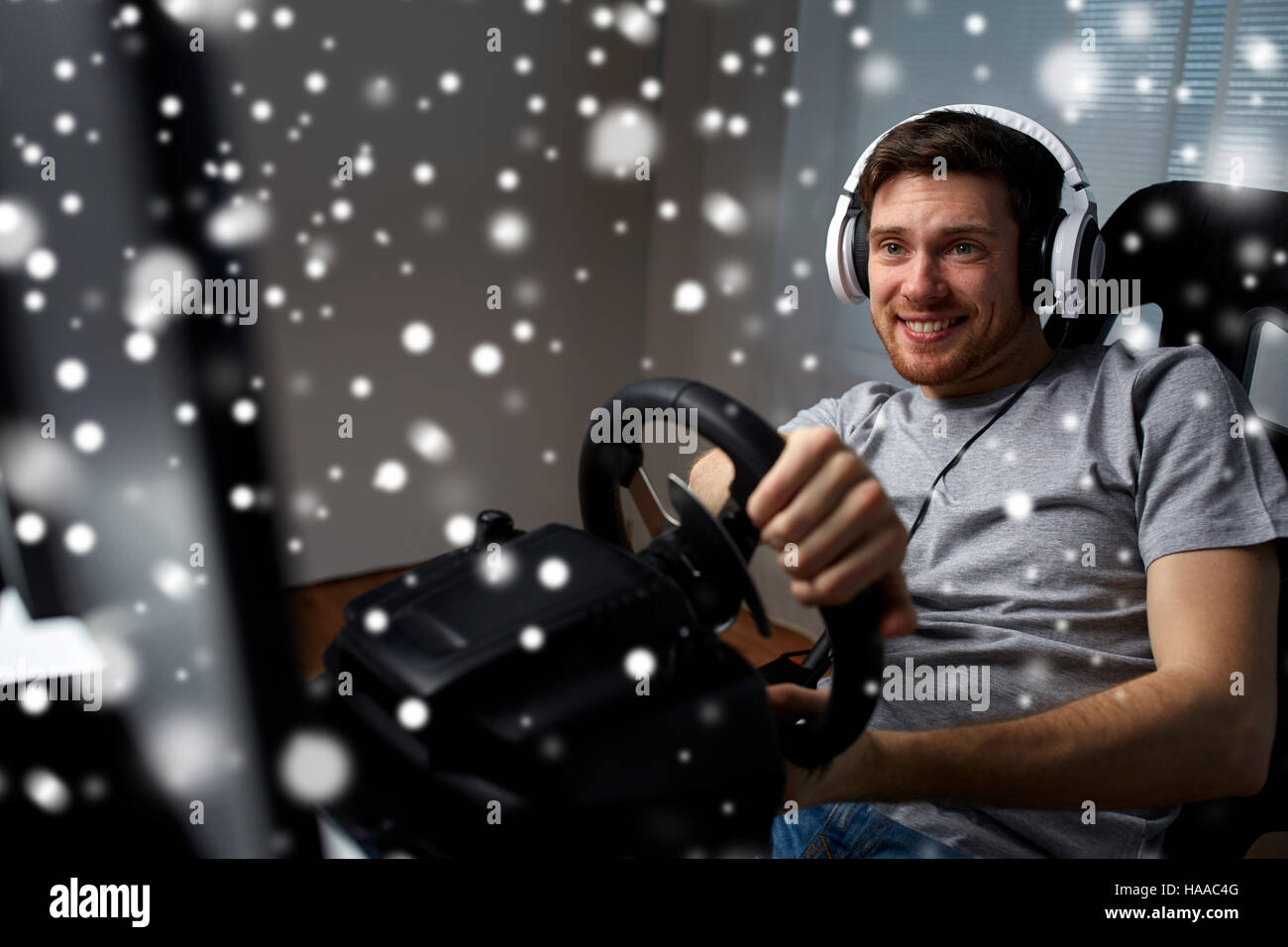 man playing car racing video game at home Stock Photo - Alamy
