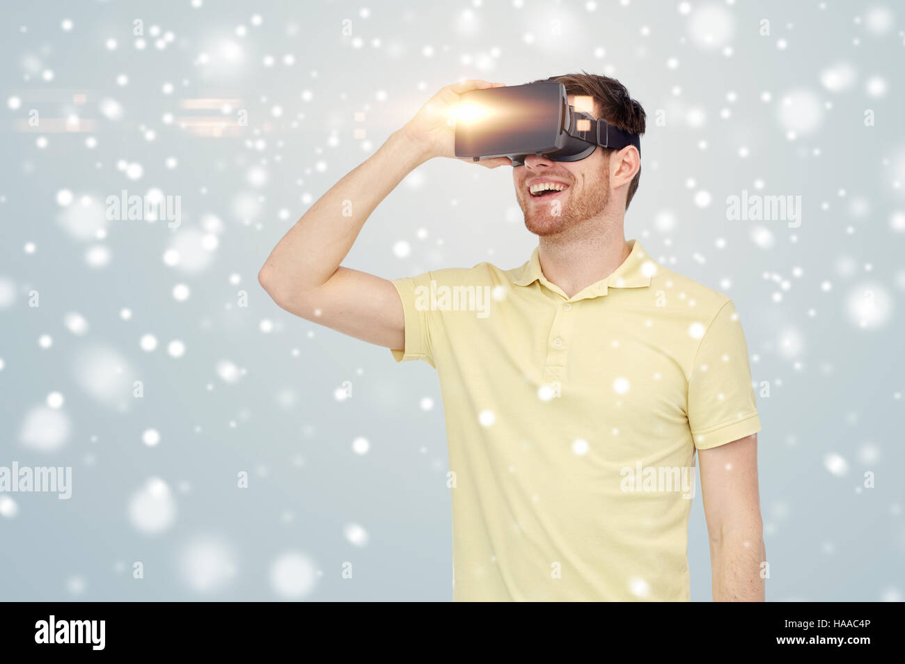 happy man in virtual reality headset or 3d glasses Stock Photo - Alamy