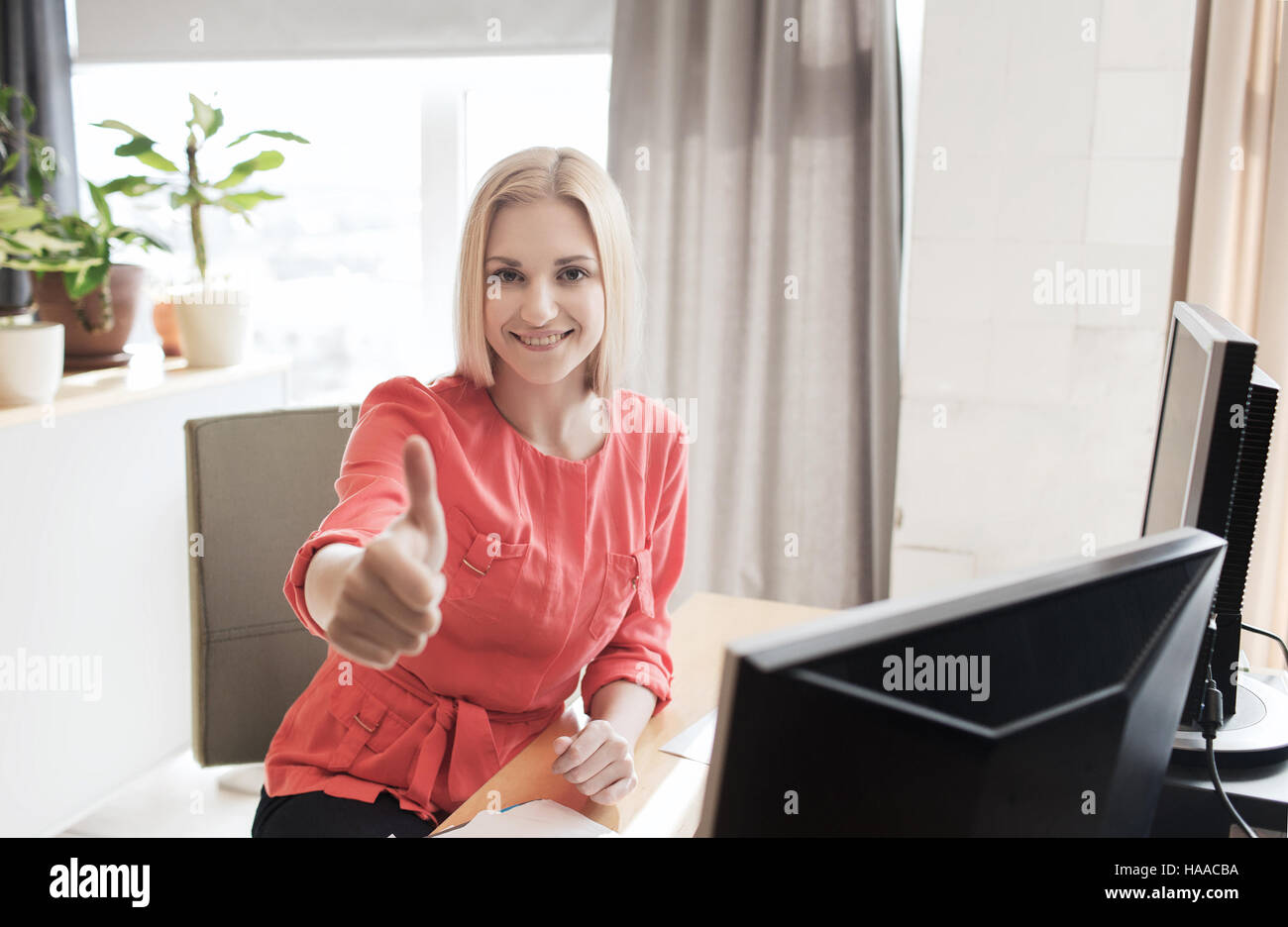 happy creative female office worker with computers Stock Photo - Alamy