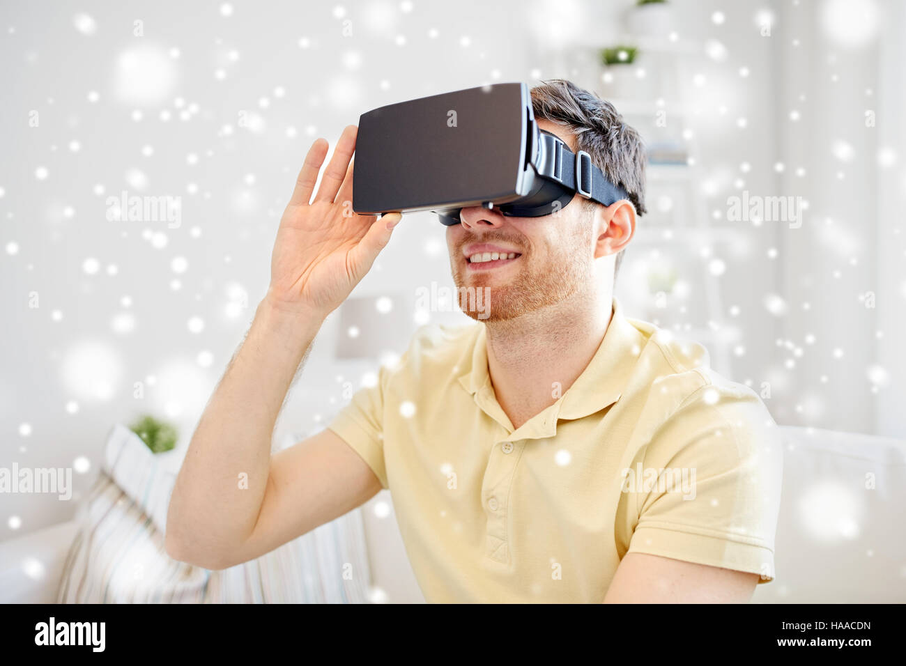 young man in virtual reality headset or 3d glasses Stock Photo - Alamy