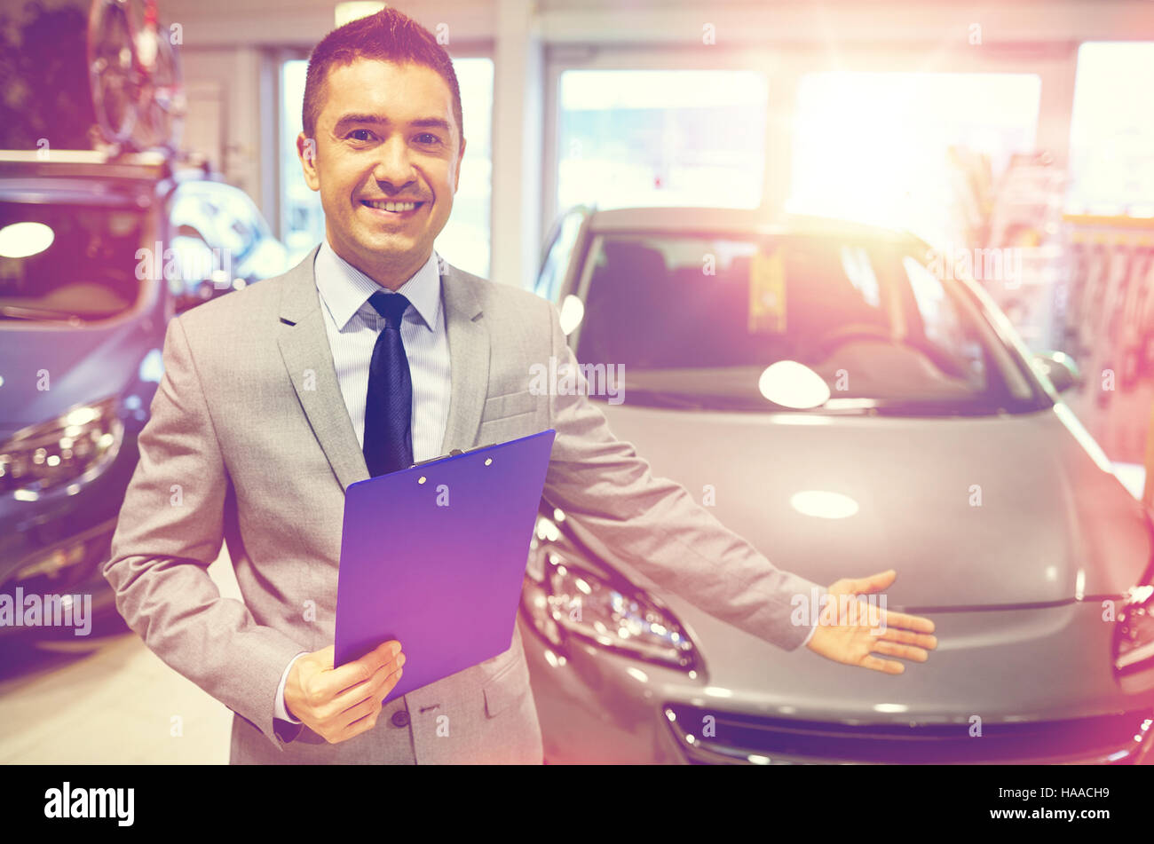 happy man at auto show or car salon Stock Photo - Alamy