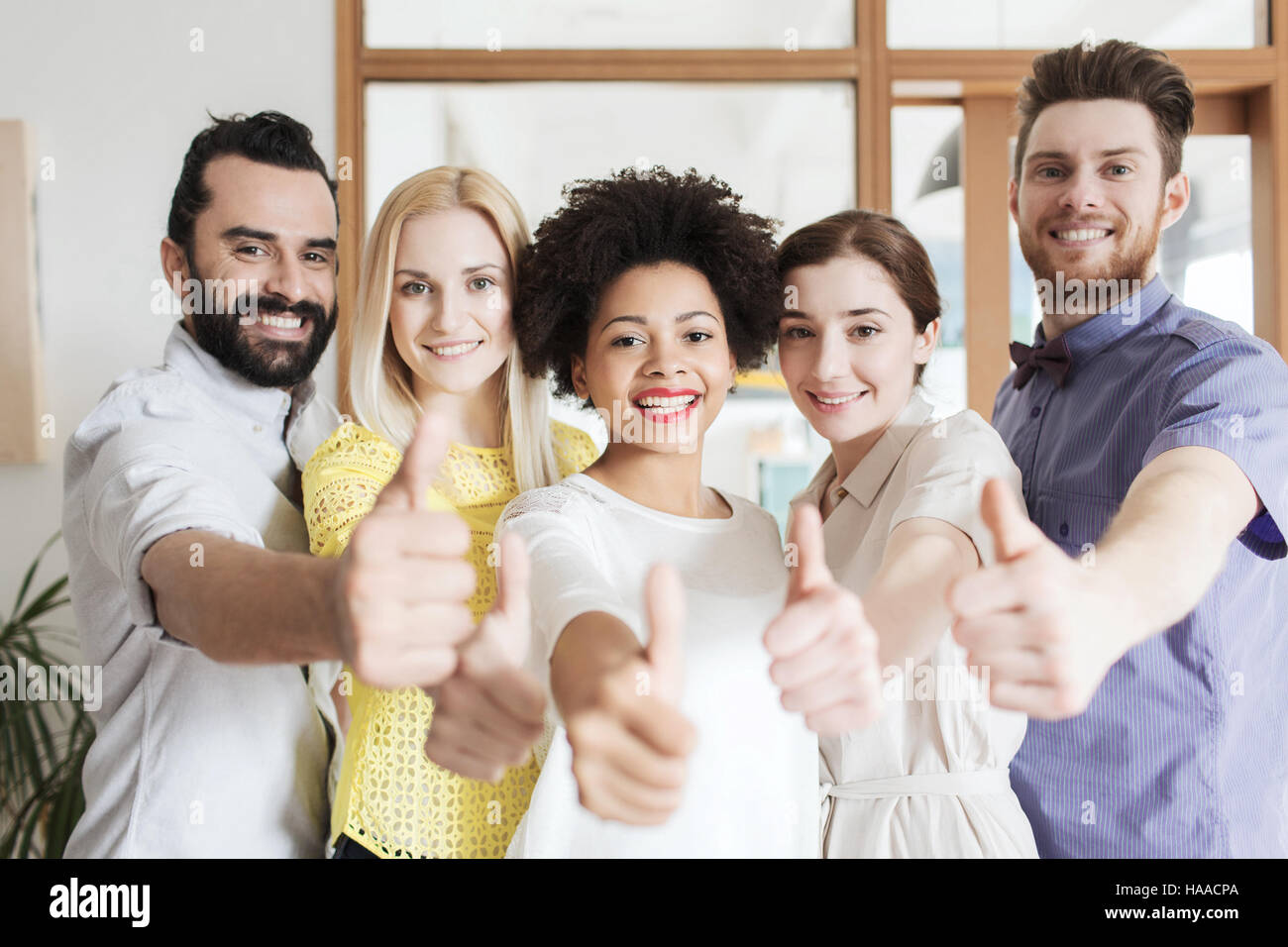 happy creative team in office Stock Photo - Alamy