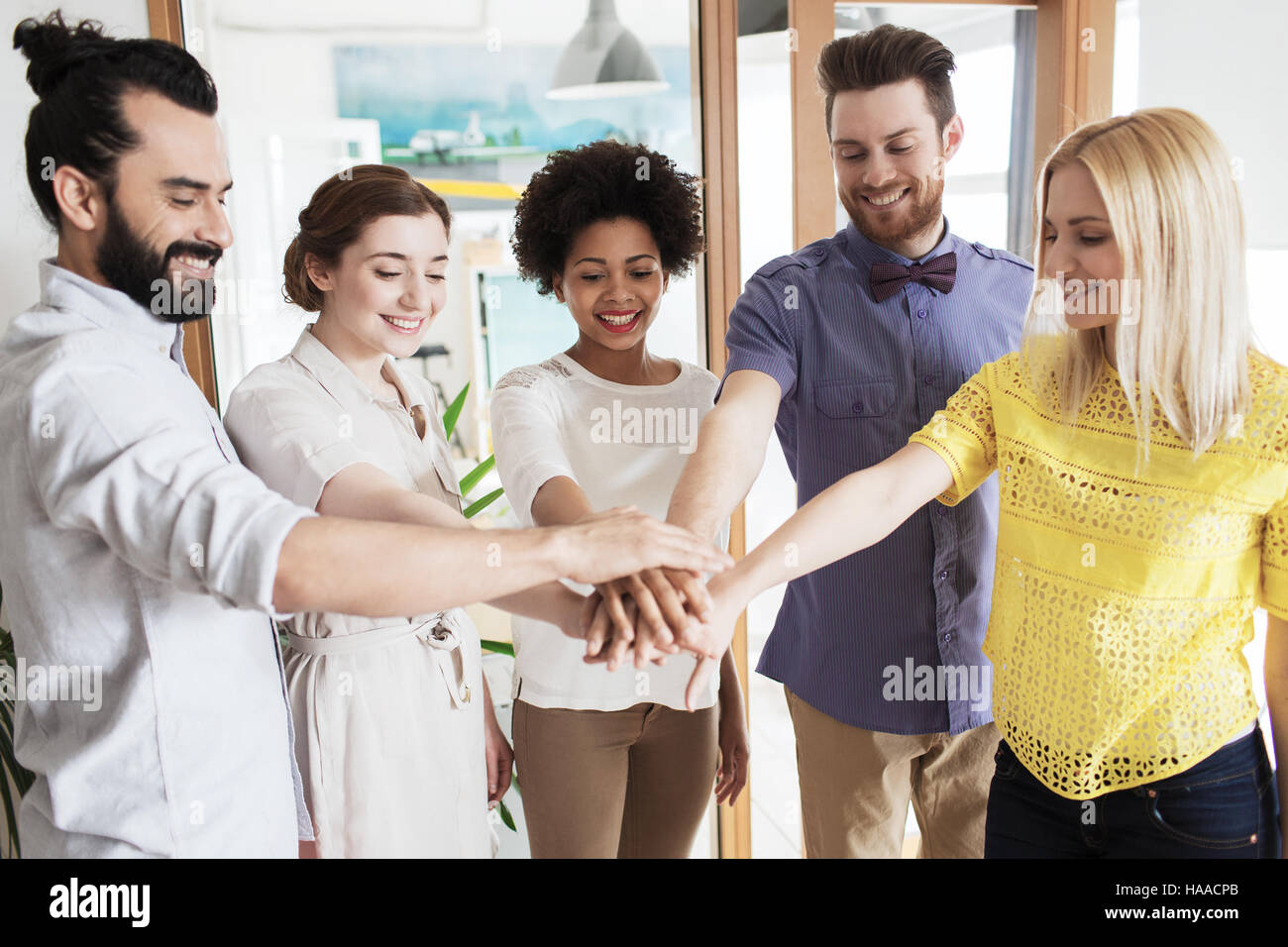 happy creative team in office Stock Photo - Alamy