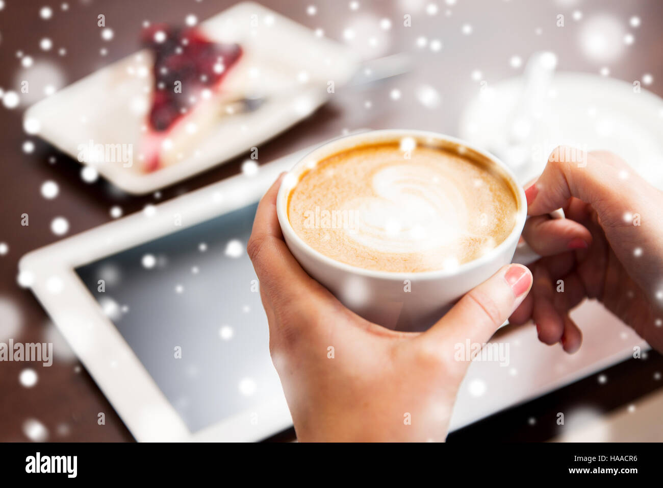 close up of hands with coffee, tablet pc and cake Stock Photo - Alamy