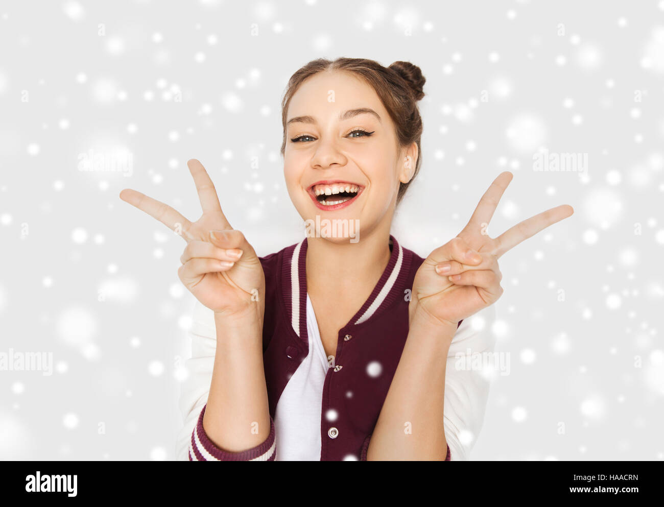 happy smiling teenage girl showing peace sign Stock Photo - Alamy
