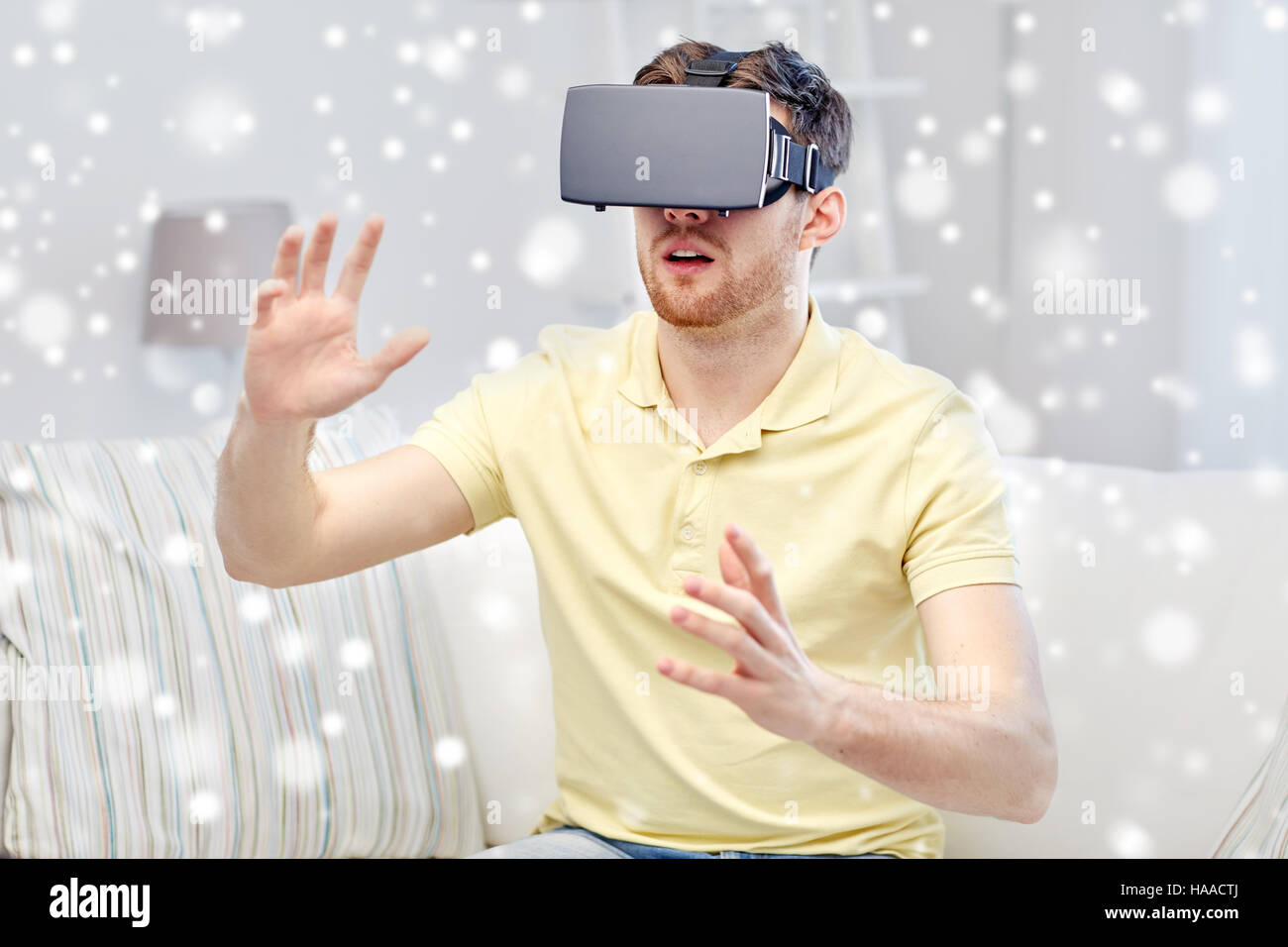 young man in virtual reality headset or 3d glasses Stock Photo - Alamy
