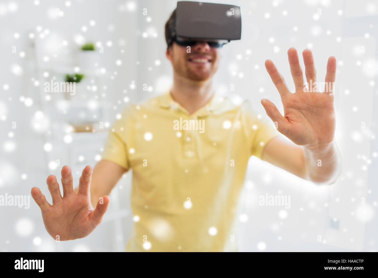 young man in virtual reality headset or 3d glasses Stock Photo - Alamy
