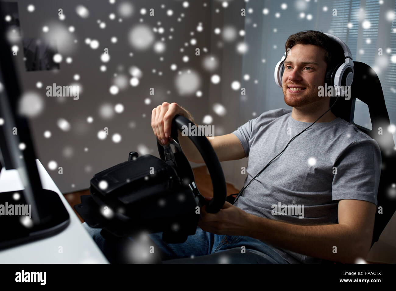 man playing car racing video game at home Stock Photo - Alamy