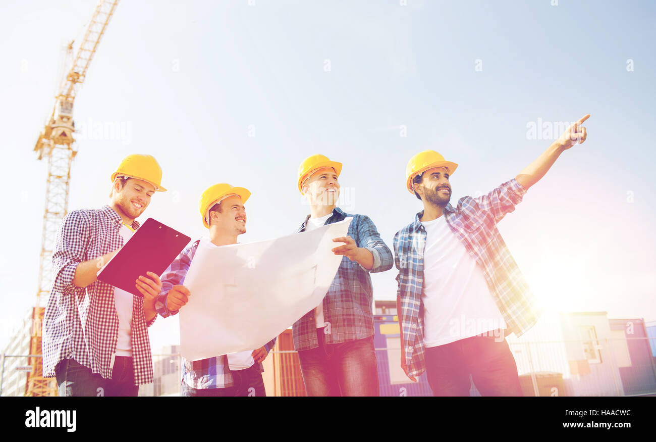 group of builders with tablet pc and blueprint Stock Photo - Alamy