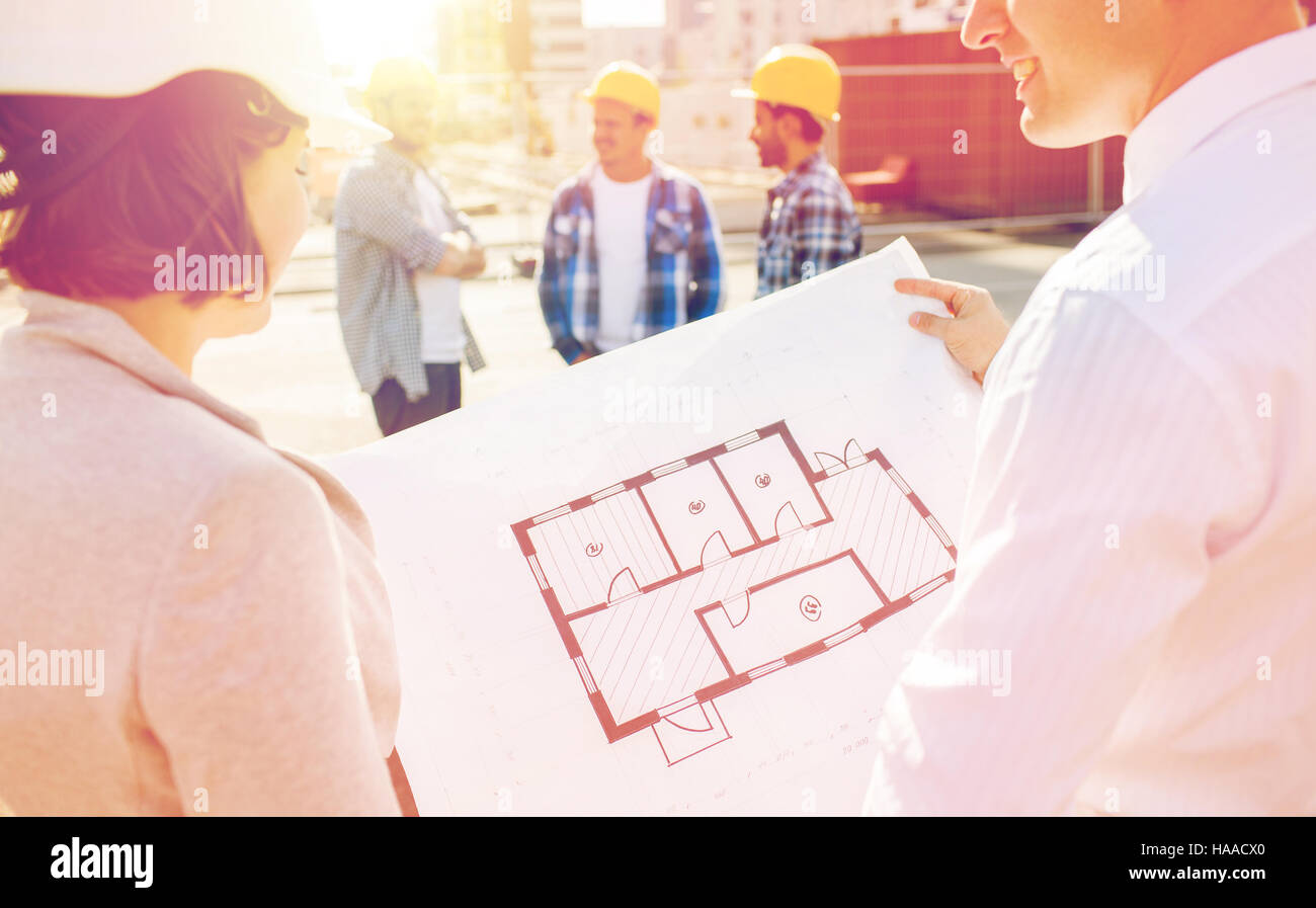 close up of architects with blueprint at building Stock Photo - Alamy