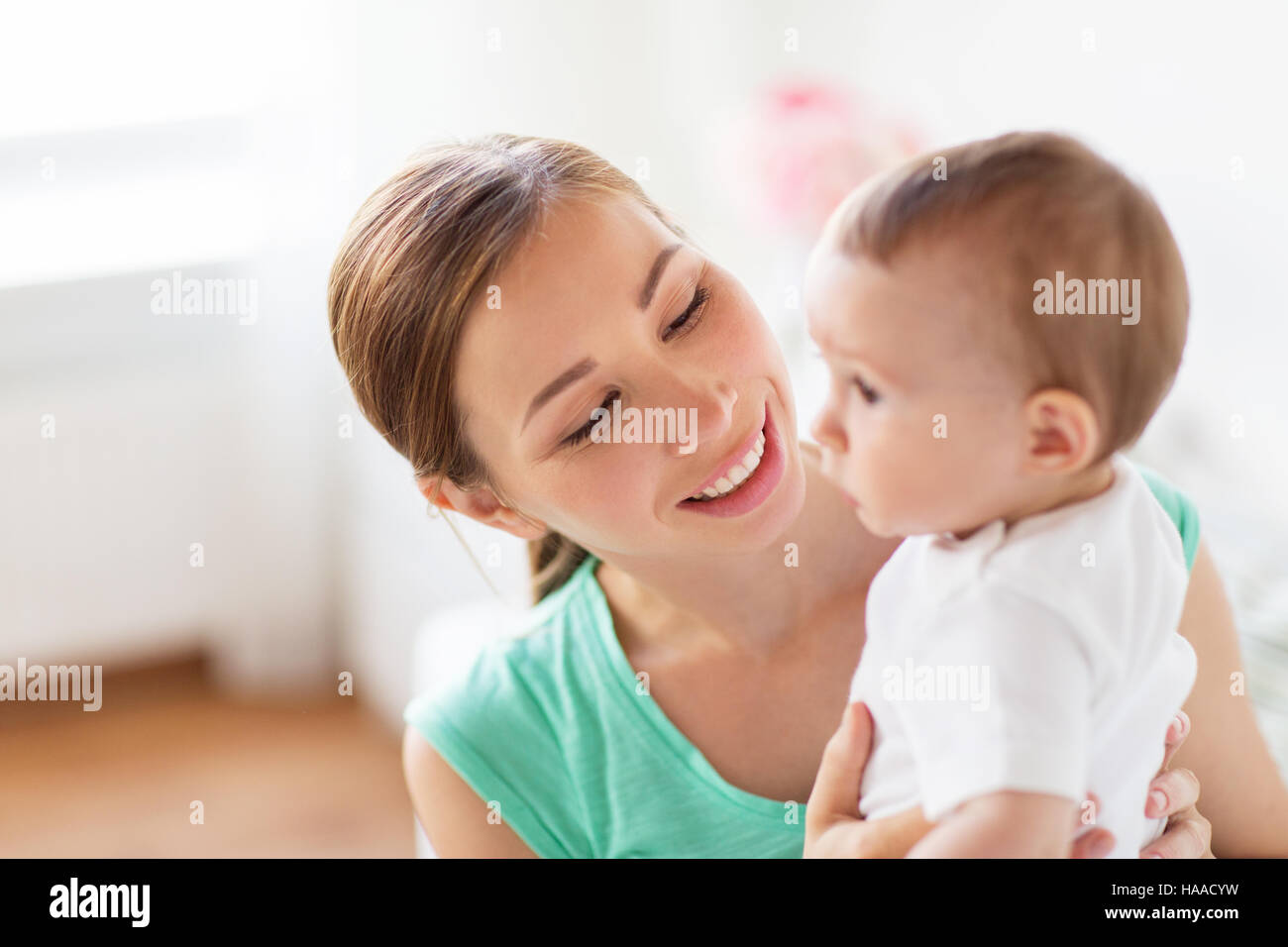happy young mother with little baby at home Stock Photo - Alamy