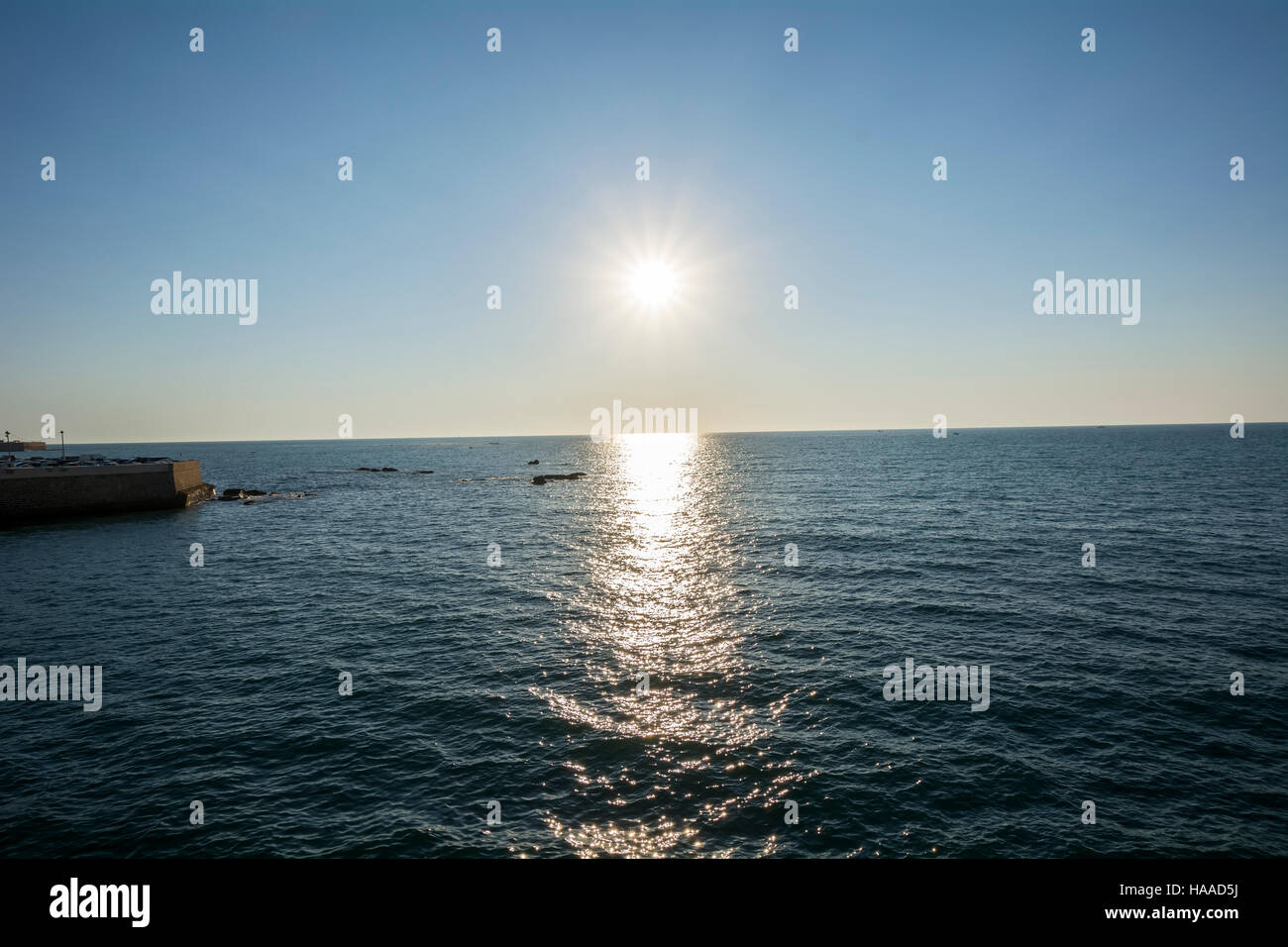 Sun reflecting off the sea Stock Photo - Alamy