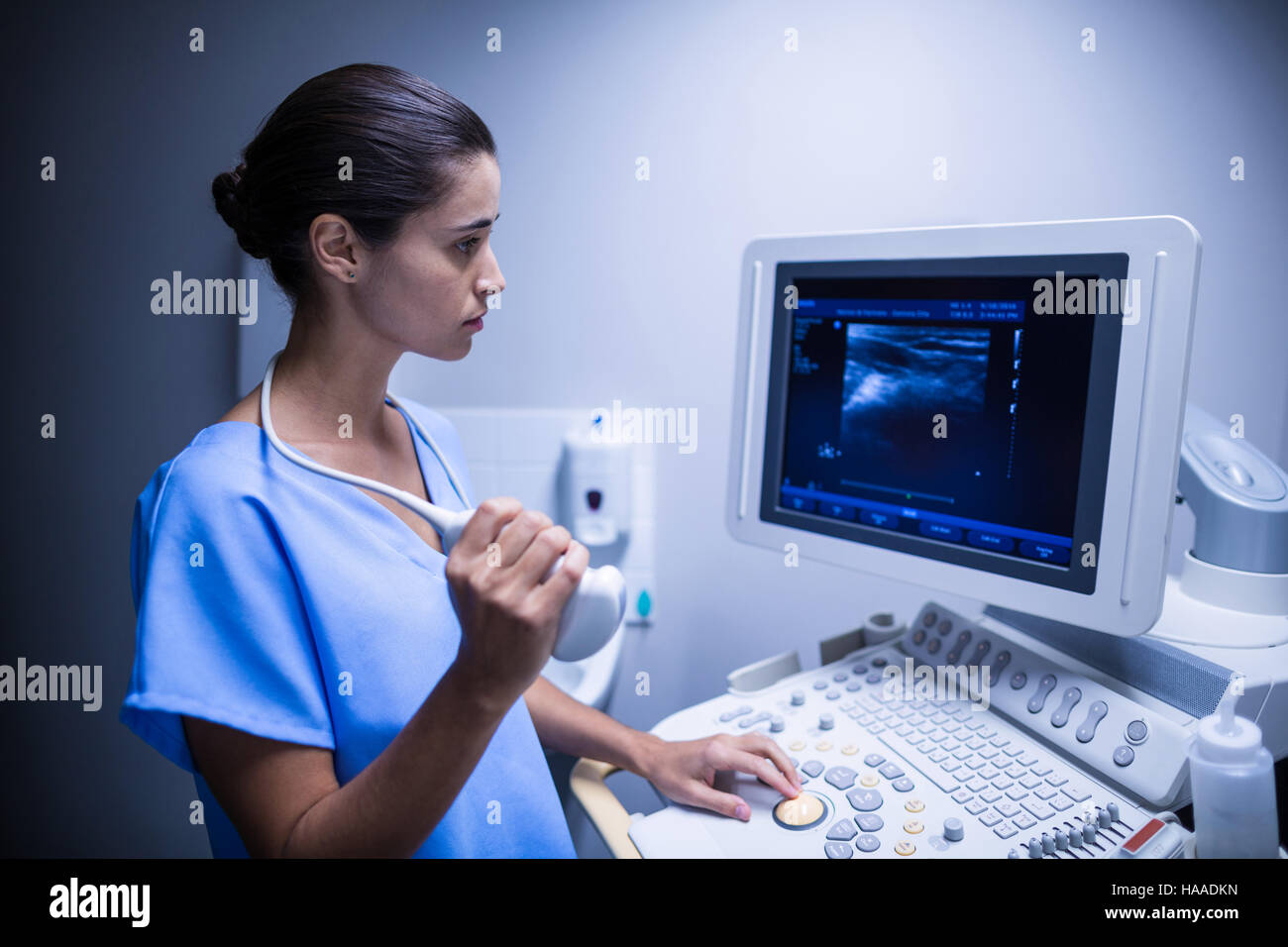 Nurse using ultrasonic device Stock Photo - Alamy