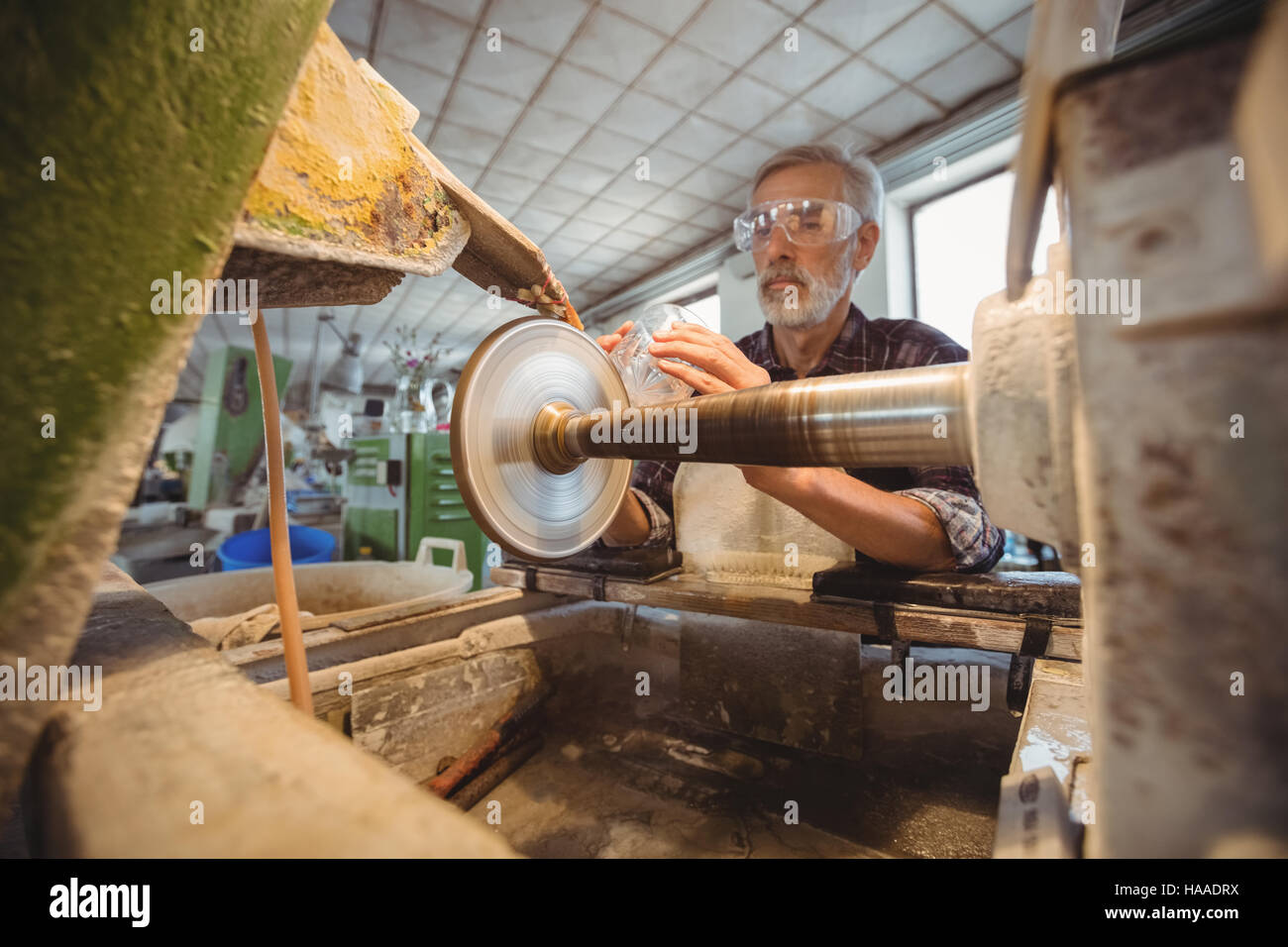 Glassblower polishing and grinding a glassware Stock Photo - Alamy