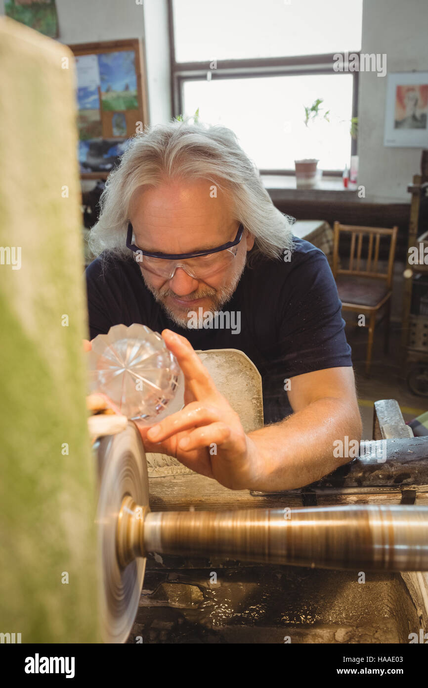 Glassblower polishing and grinding a glassware Stock Photo - Alamy