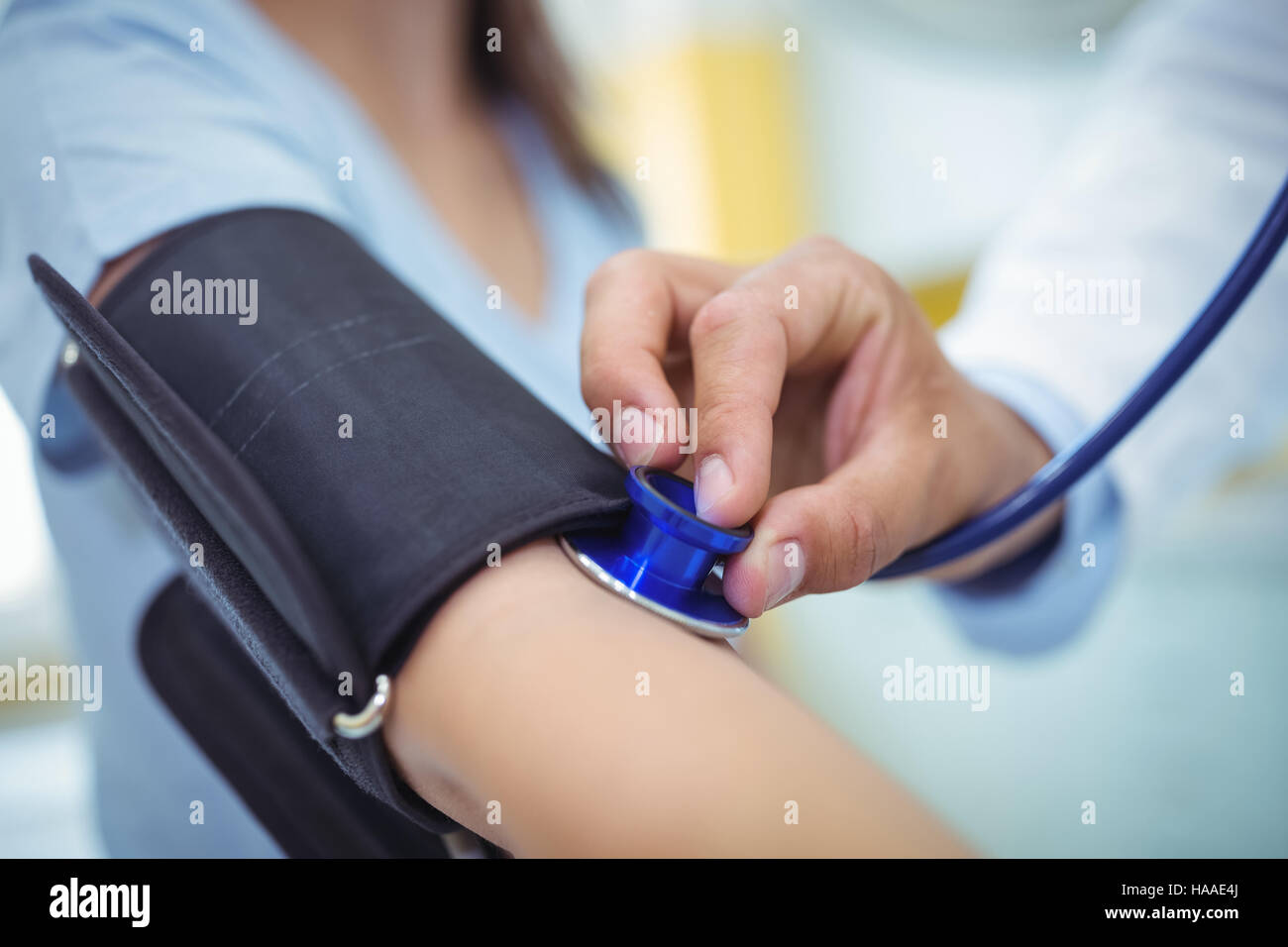 Woman doctor checking pressure patient hi-res stock photography and ...