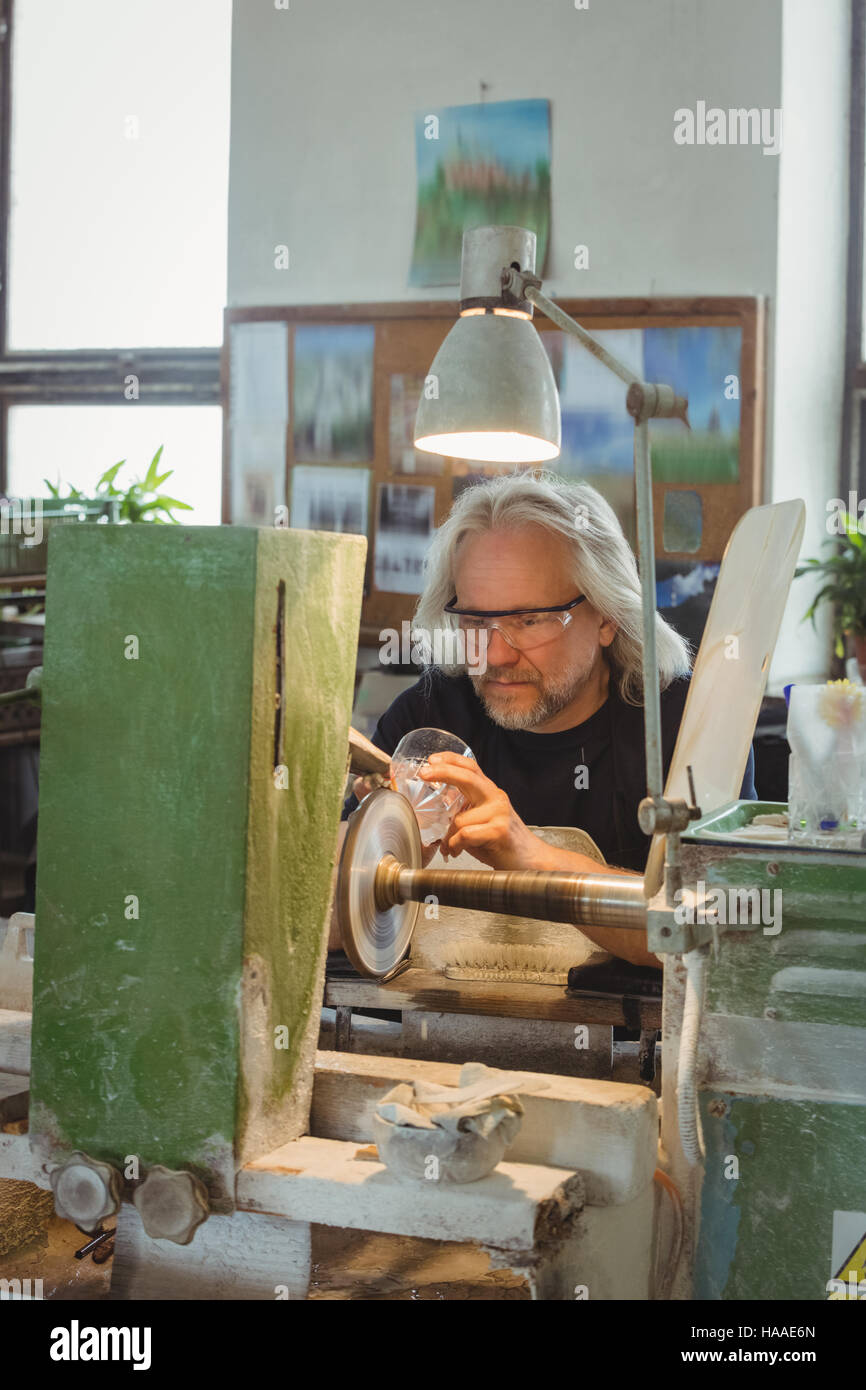 Glassblower polishing and grinding a glassware Stock Photo - Alamy