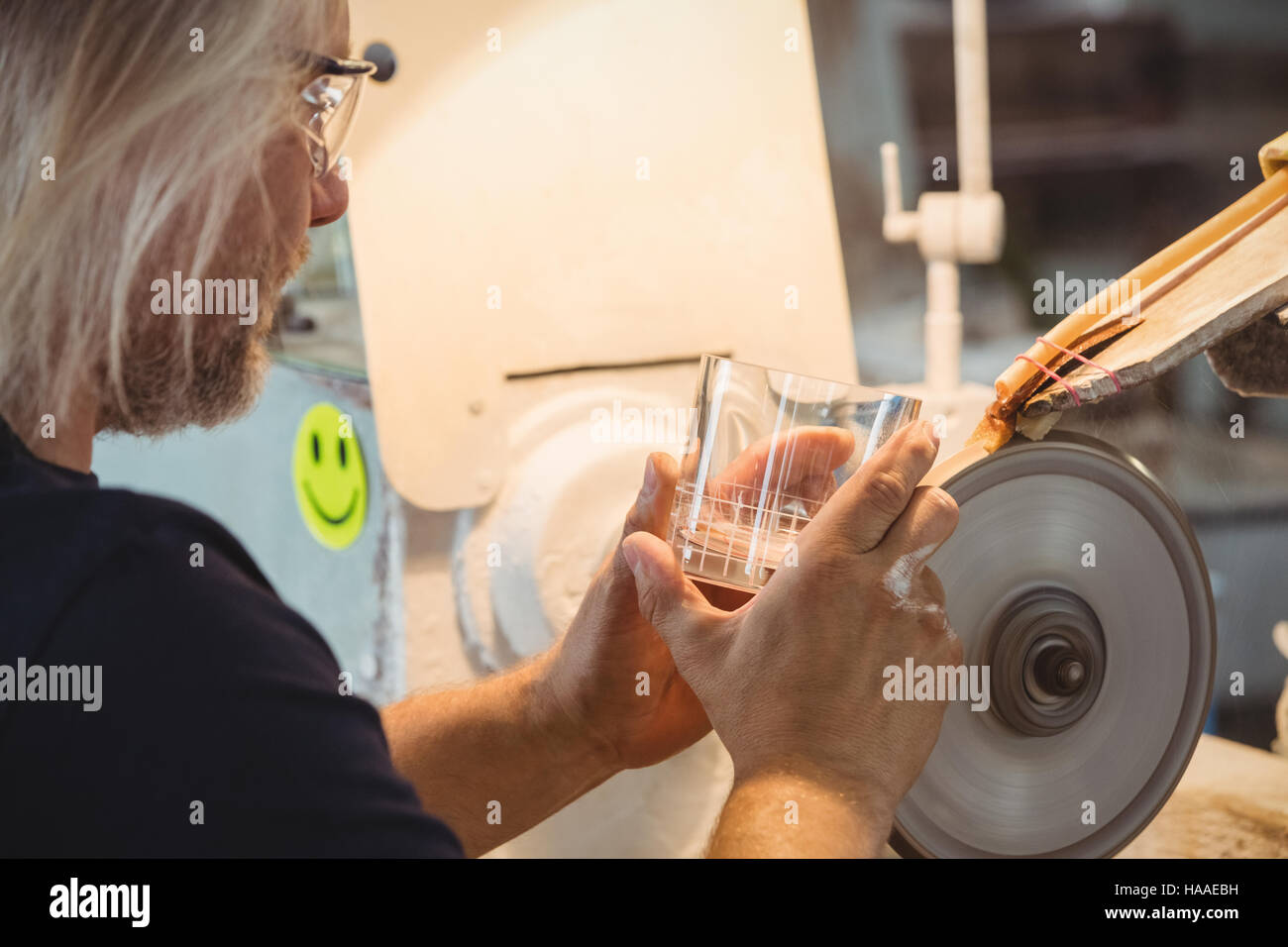 Glassblower polishing and grinding a glassware Stock Photo - Alamy