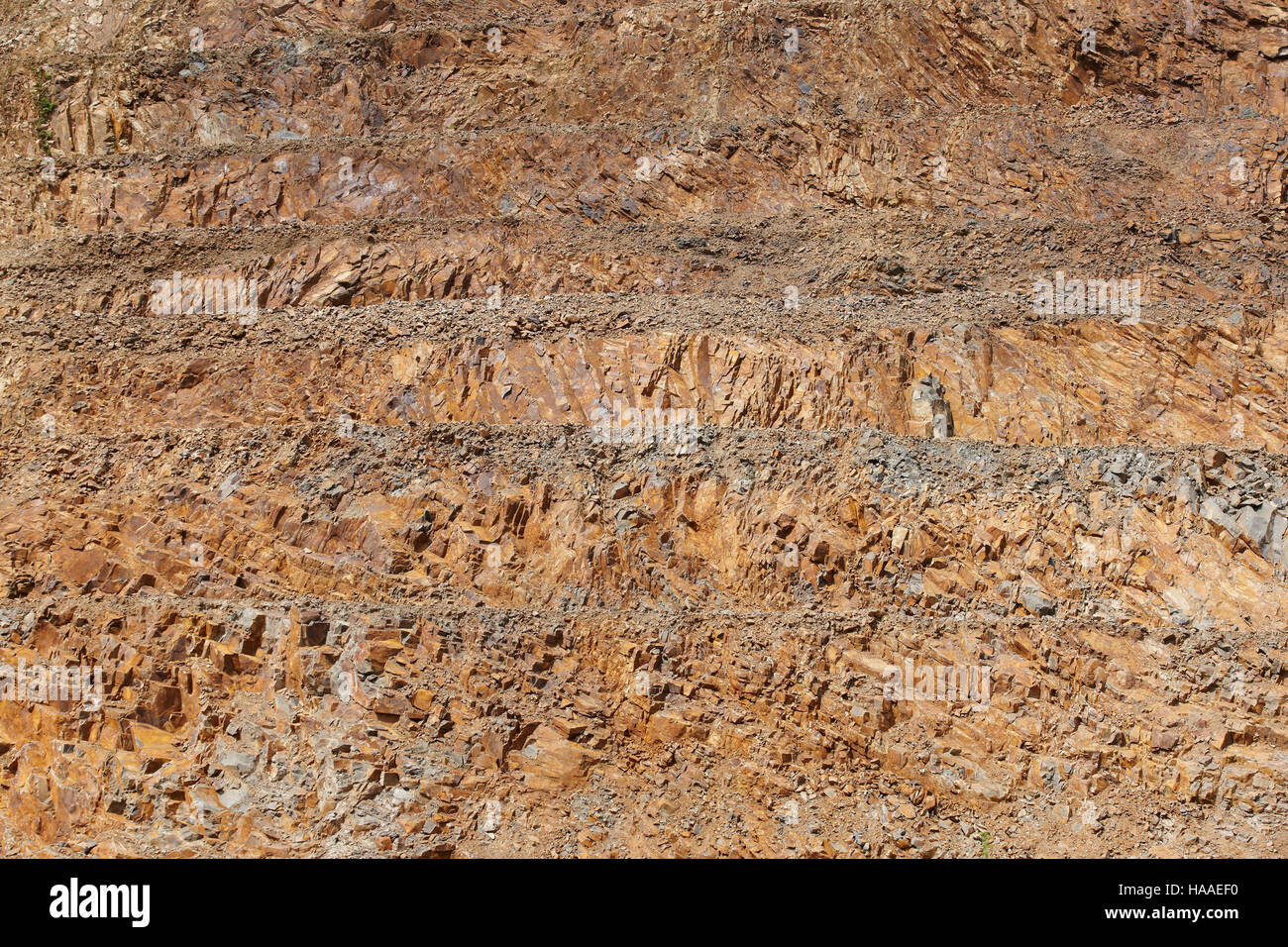 Limestone quarry vertical wall. Rocky substrate by levels. Horizontal ...