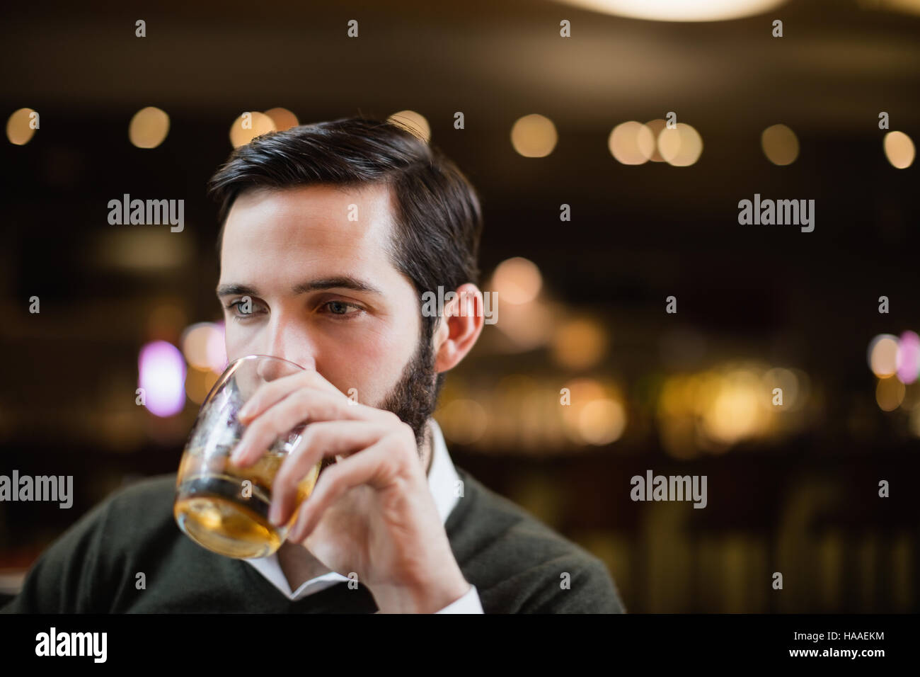 Man having drink in bar Stock Photo - Alamy
