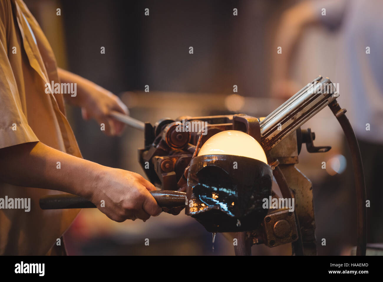 Glassblower forming and shaping a molten glass Stock Photo - Alamy