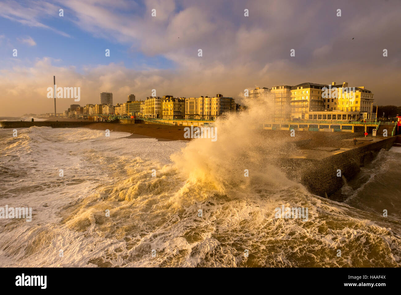 Waves crashing onto Brighton seafront Stock Photo - Alamy