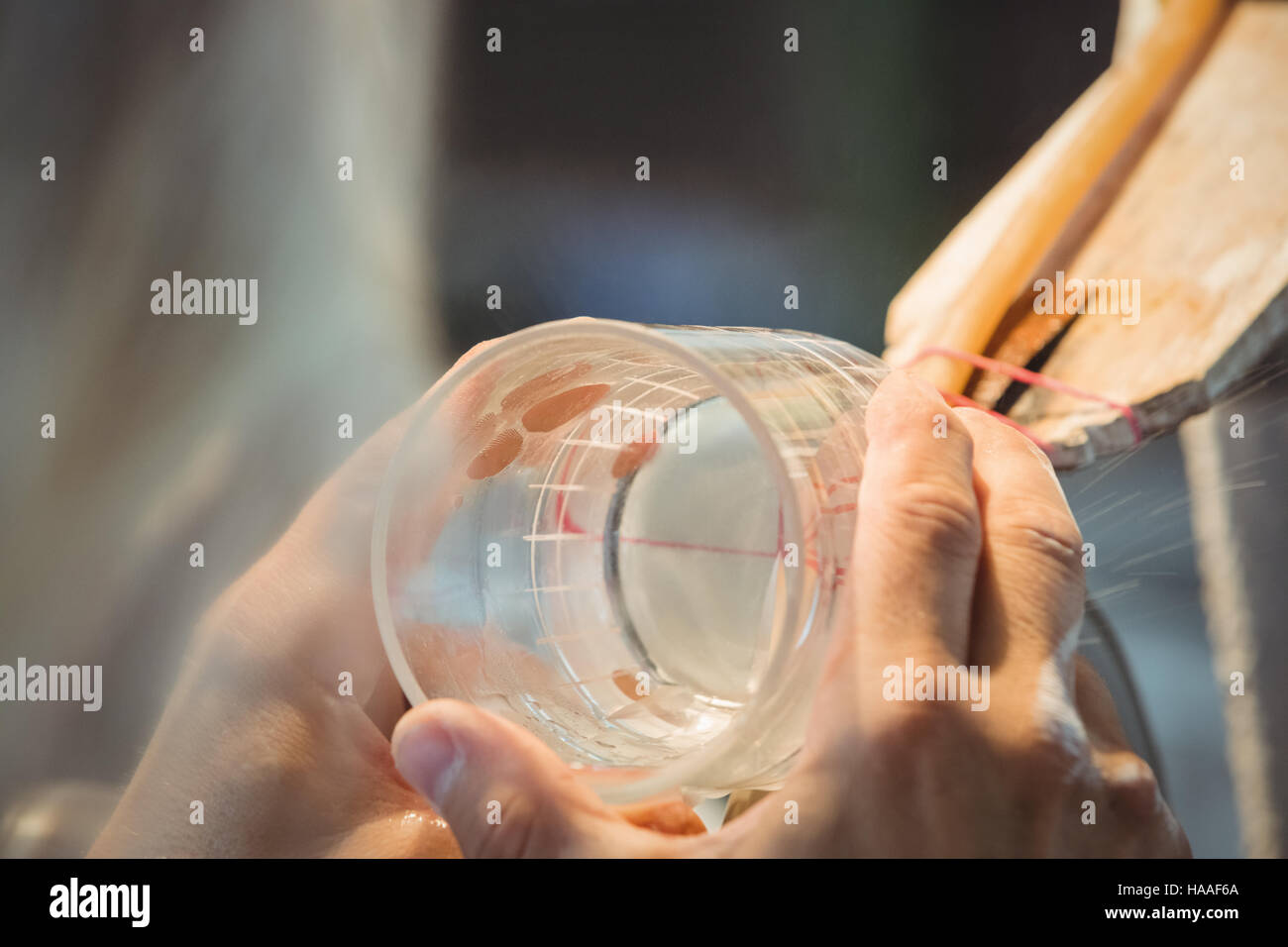Glassblower polishing and grinding a glassware Stock Photo - Alamy