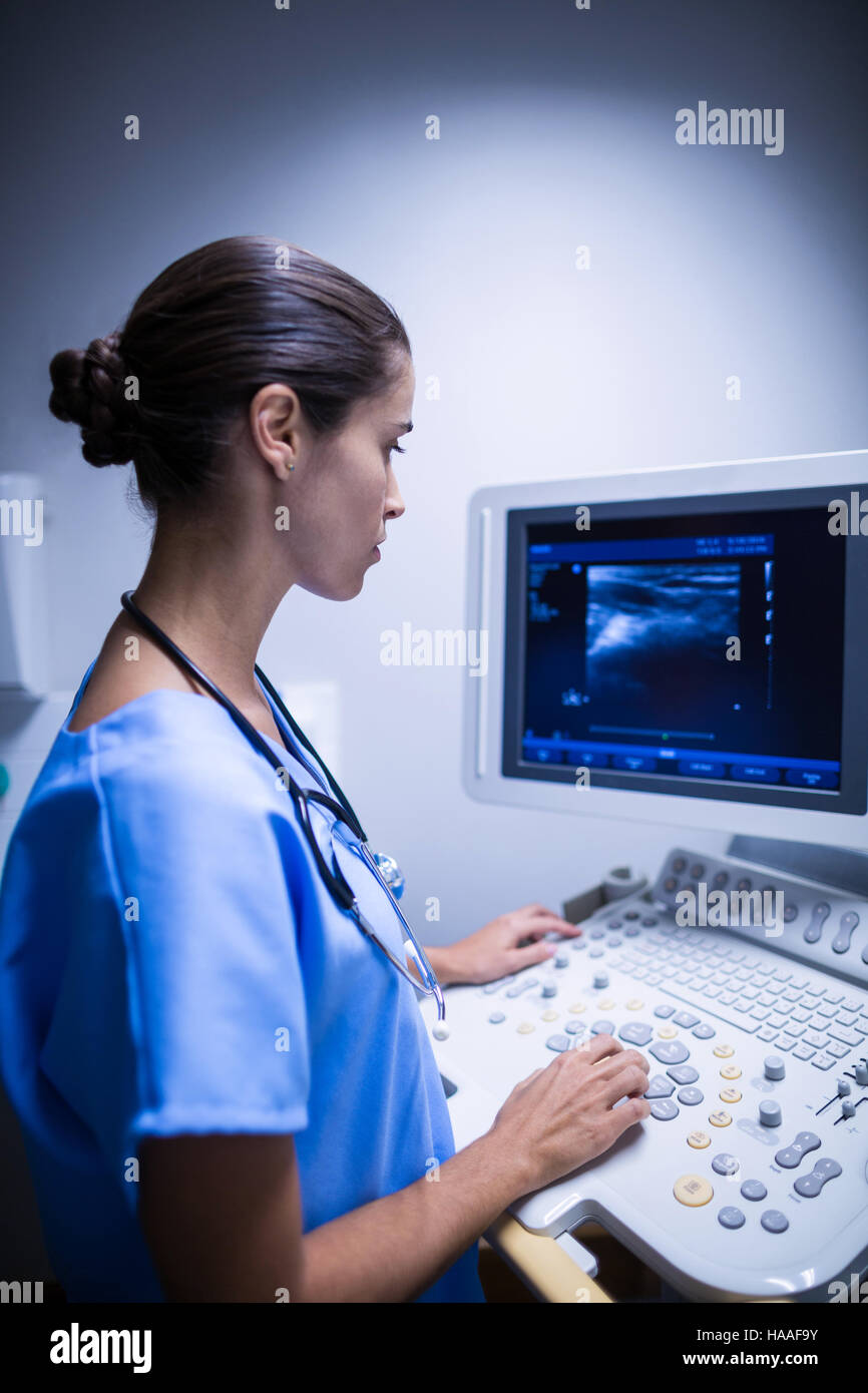 Nurse using ultrasonic device Stock Photo - Alamy