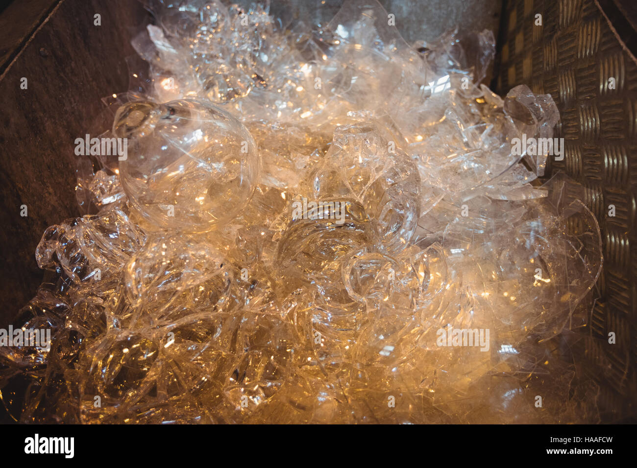 Close-up of waste glass in a metal container Stock Photo - Alamy