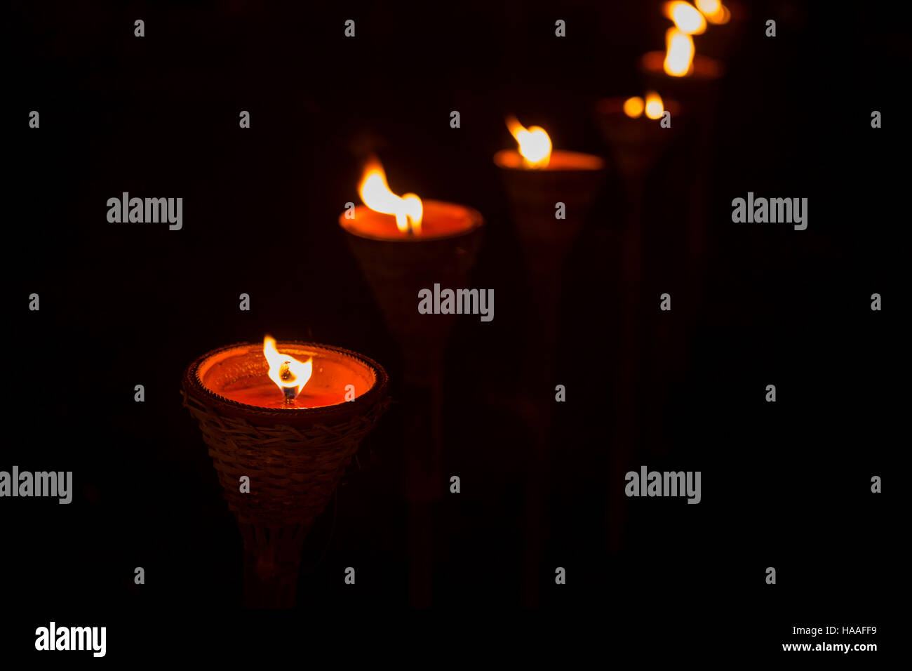 Traditional wooden torch flame at night Stock Photo - Alamy