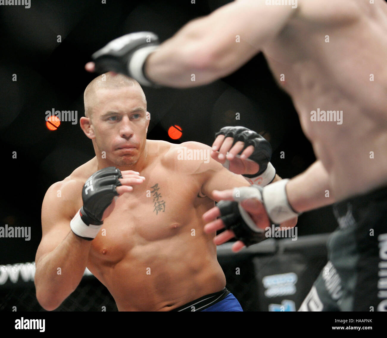 Georges St. Pierre, left, fights Matt Hughes during UFC 79 at the ...