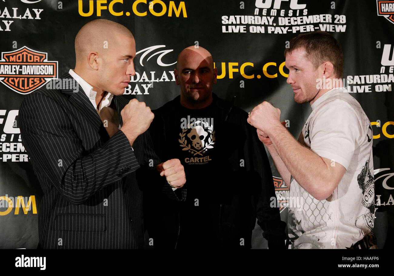 Georges St. Pierre, left, and Matt Hughes pose for photos during a ...