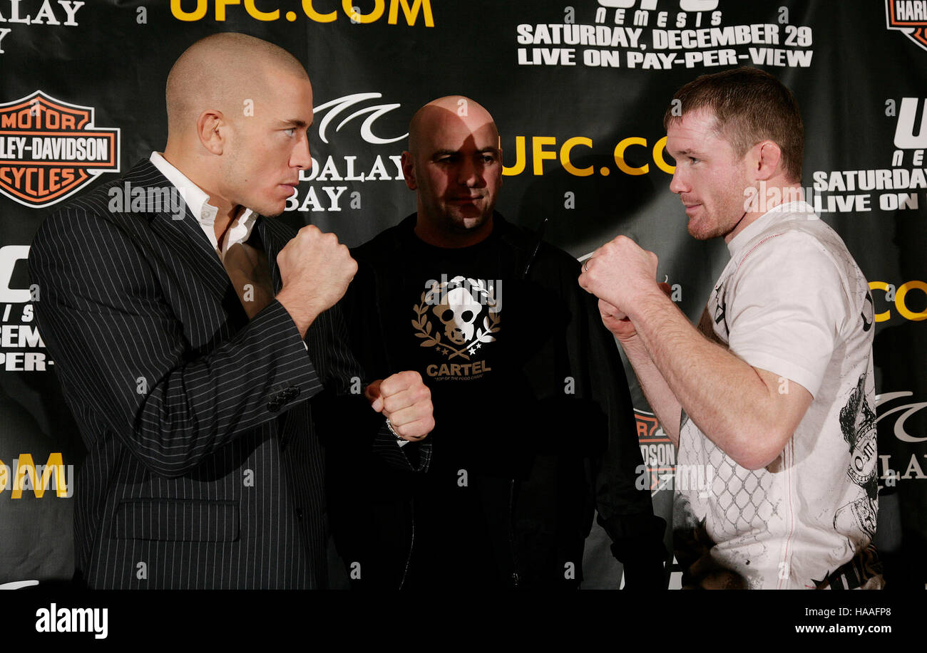 Georges St. Pierre, left, and Matt Hughes pose for photos during a ...