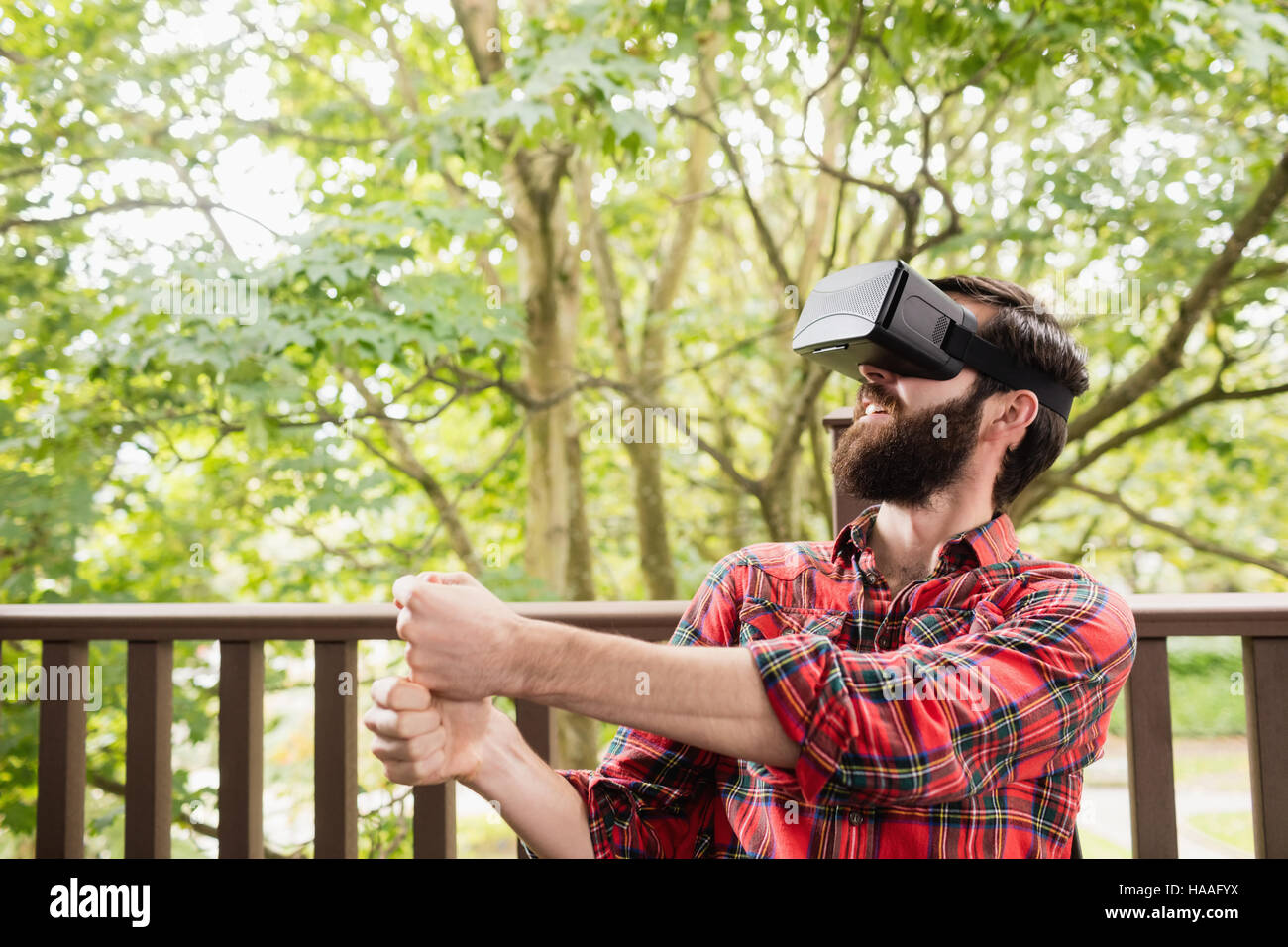 Man using virtual reality headset Stock Photo - Alamy