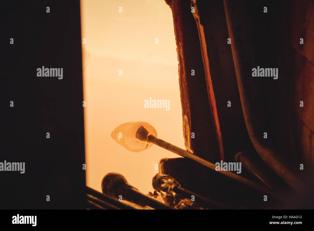 Glass heated in glassblowers oven Stock Photo - Alamy