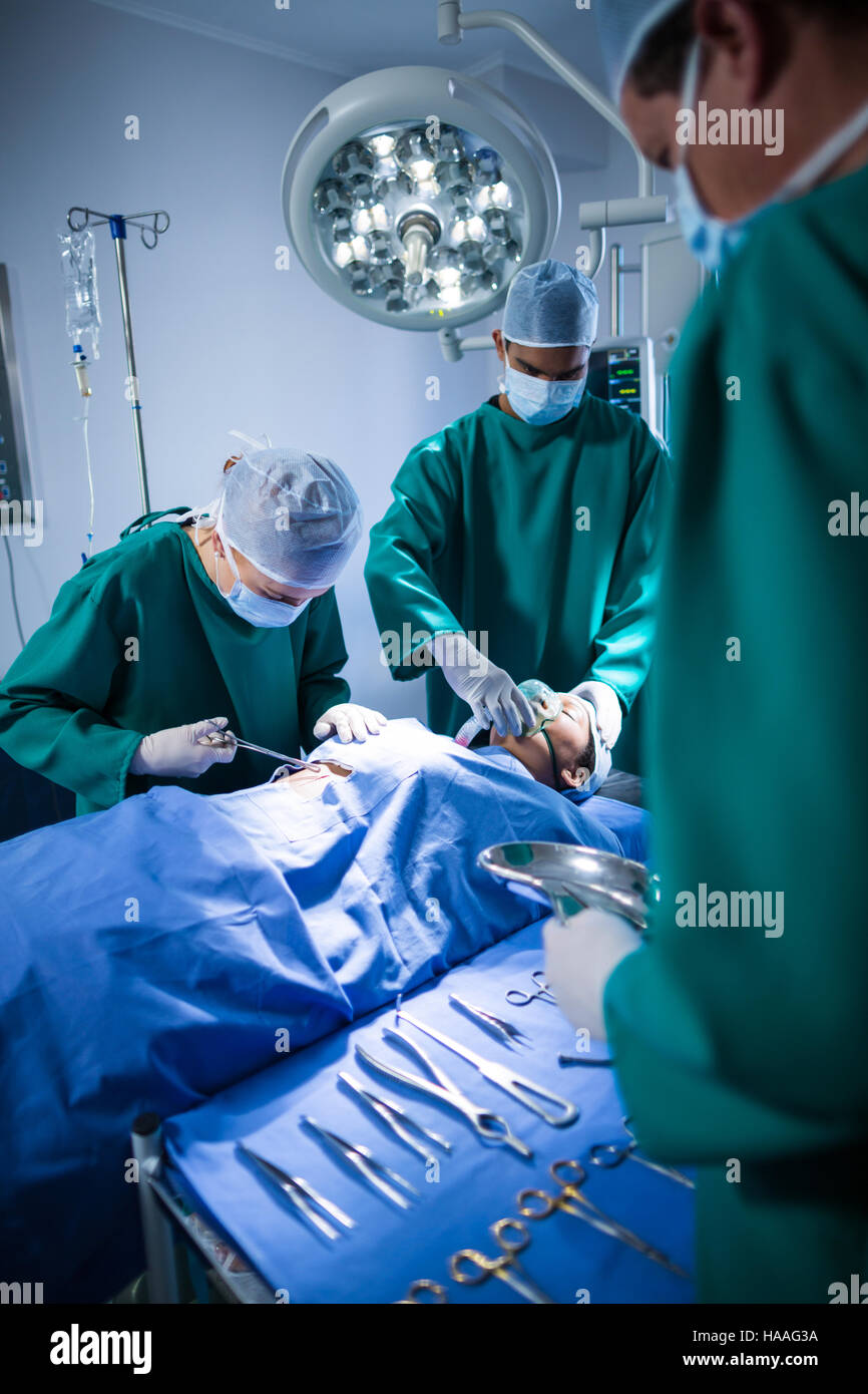 Surgeons performing operation in operation theater Stock Photo - Alamy