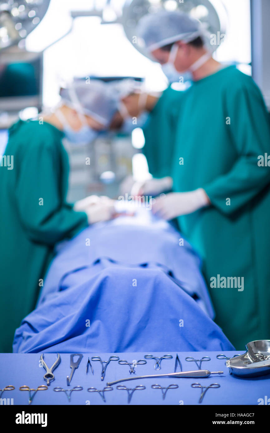Surgeons performing operation in operation theater Stock Photo - Alamy