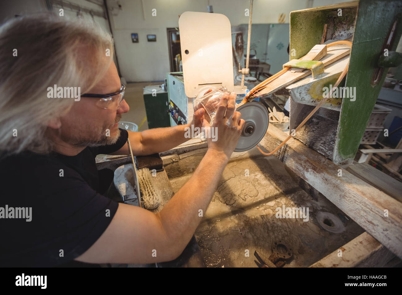 Glassblower polishing and grinding a glassware Stock Photo - Alamy