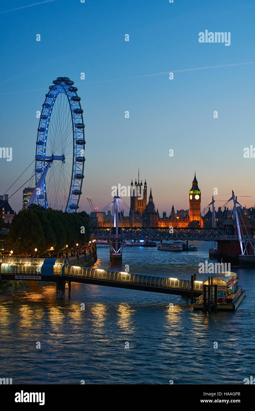 The London Eye and Westminster at dusk, with Festival pier on the ...